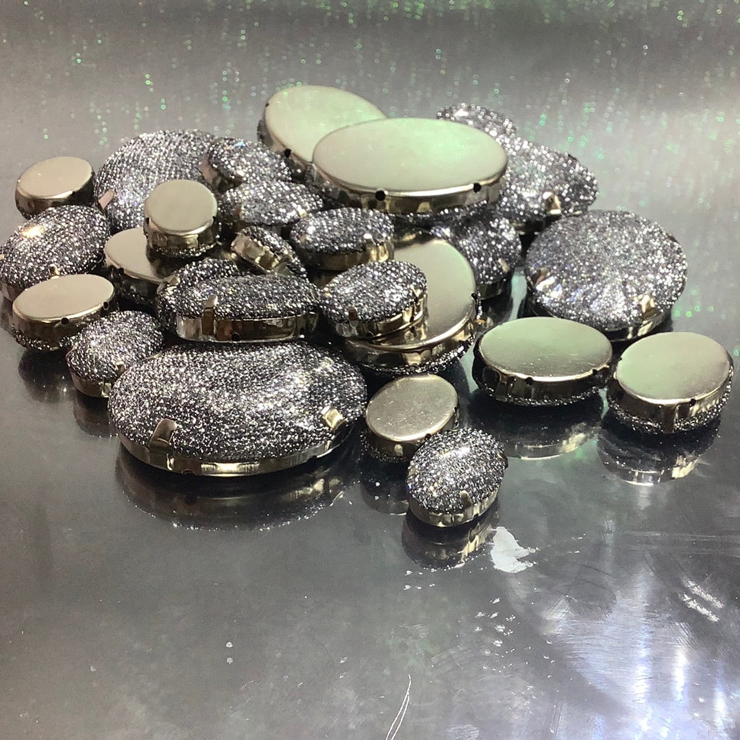 Oval shaped button with mesh over it – www.jimmybuttons.com.au